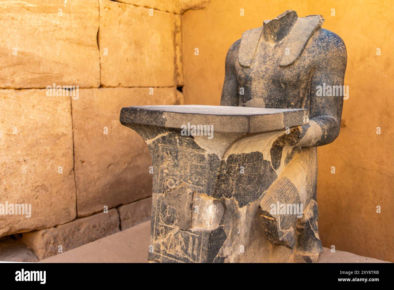 The colossal statue of an ancient Egyptian deity guarding the sacred ...