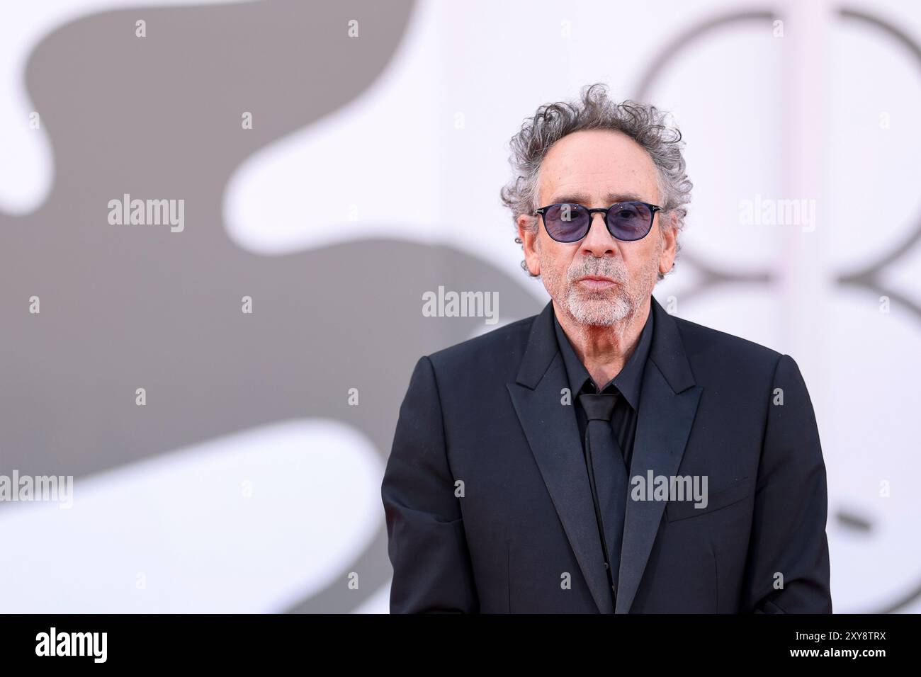 Director Tim Burton poses for photographers upon arrival for the ...