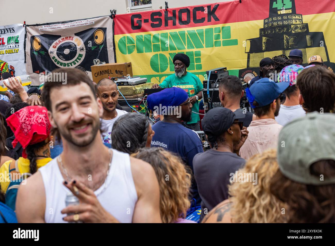 London, UK. 26th August, 2024. Mikey Dread (c) entertains revellers at ...