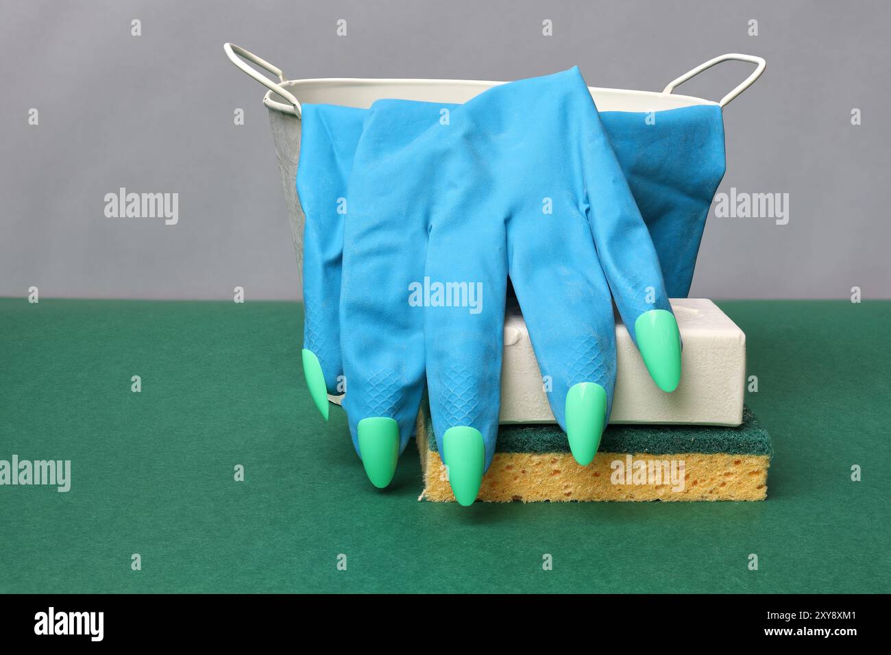 Still life: gloves with artificial nails, soap, sponge for washing and ...
