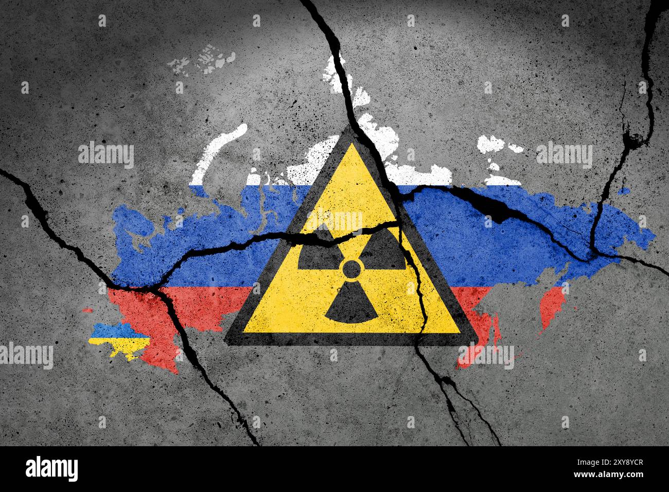 Flag of Ukraine and Russia painted on a concrete wall with atomic bomb ...