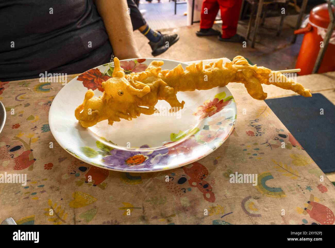 making chinese dragon donut in chiang mai, thailand Stock Photo - Alamy