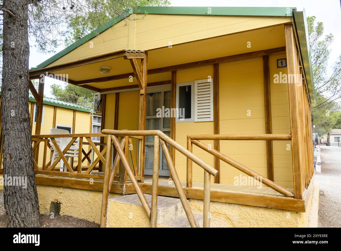 Wooden houses in a triangular summer camp. summer vacation in an eco ...