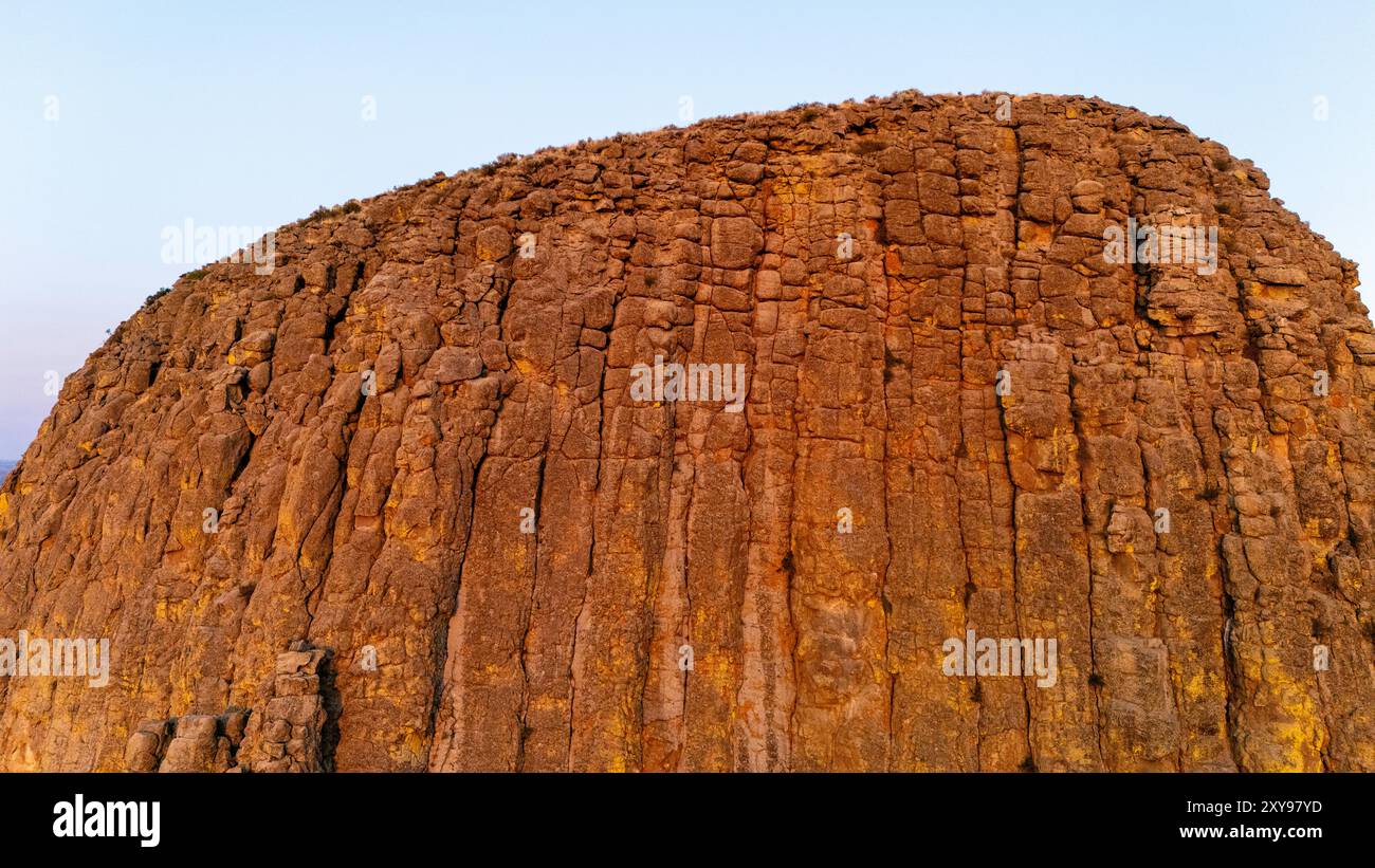 Aerial photograph of the side of Devils Tower National Monument ...