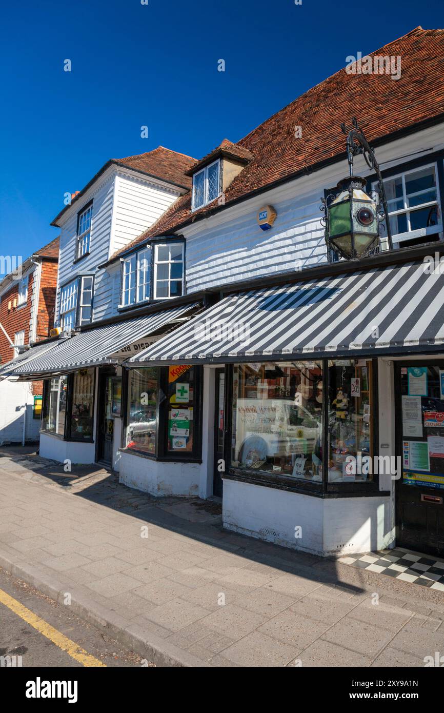 UK, England, Kent, Tenterden, The High Street with traditional Chemist ...