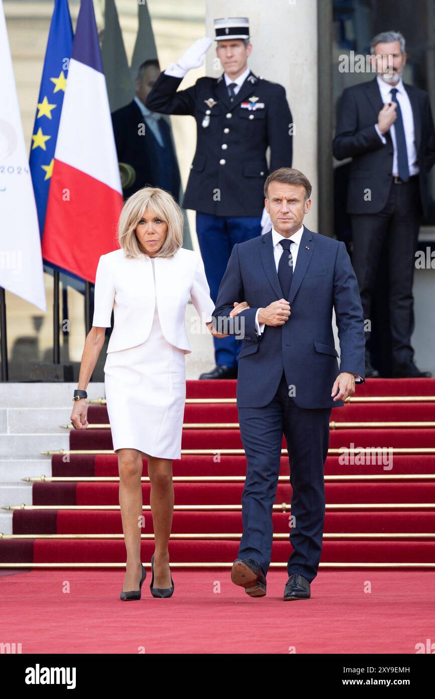 Paris, France. 28th Aug, 2024. France's President Emmanuel Macron walks ...