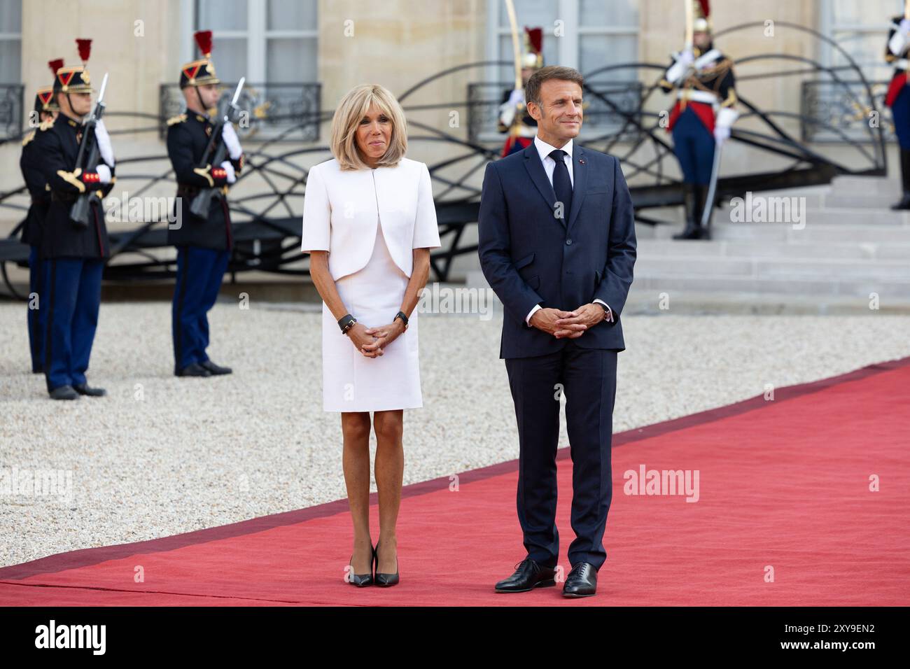 Paris, France. 28th Aug, 2024. France's President Emmanuel Macron walks ...