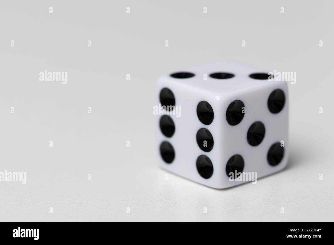 White cube dice macro close up view on studio background Stock Photo ...
