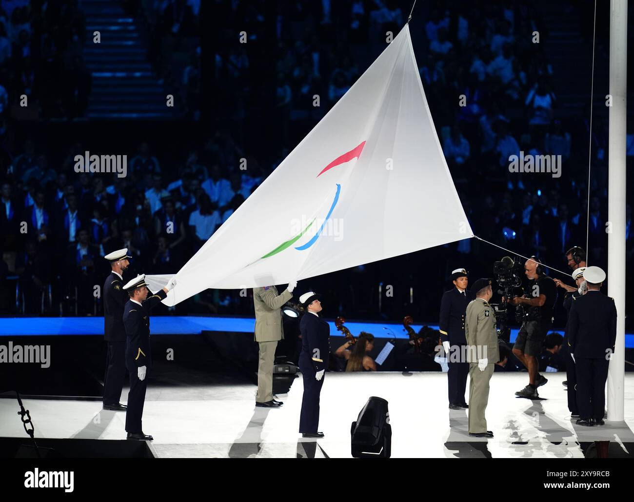 The Paralympic flag is raised on stage during the opening ceremony of ...