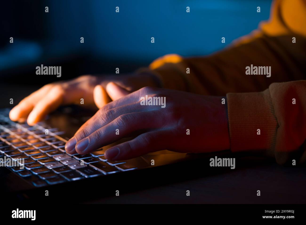 Hand types on laptop keyboard hi-res stock photography and images - Alamy