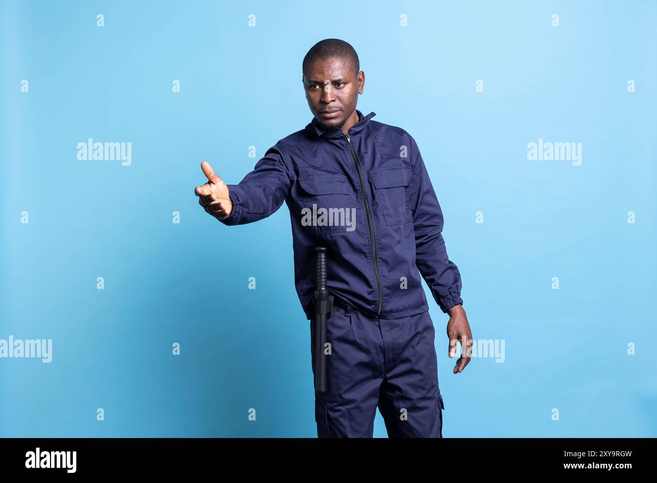 African american security agent indicating the direction for persons ...