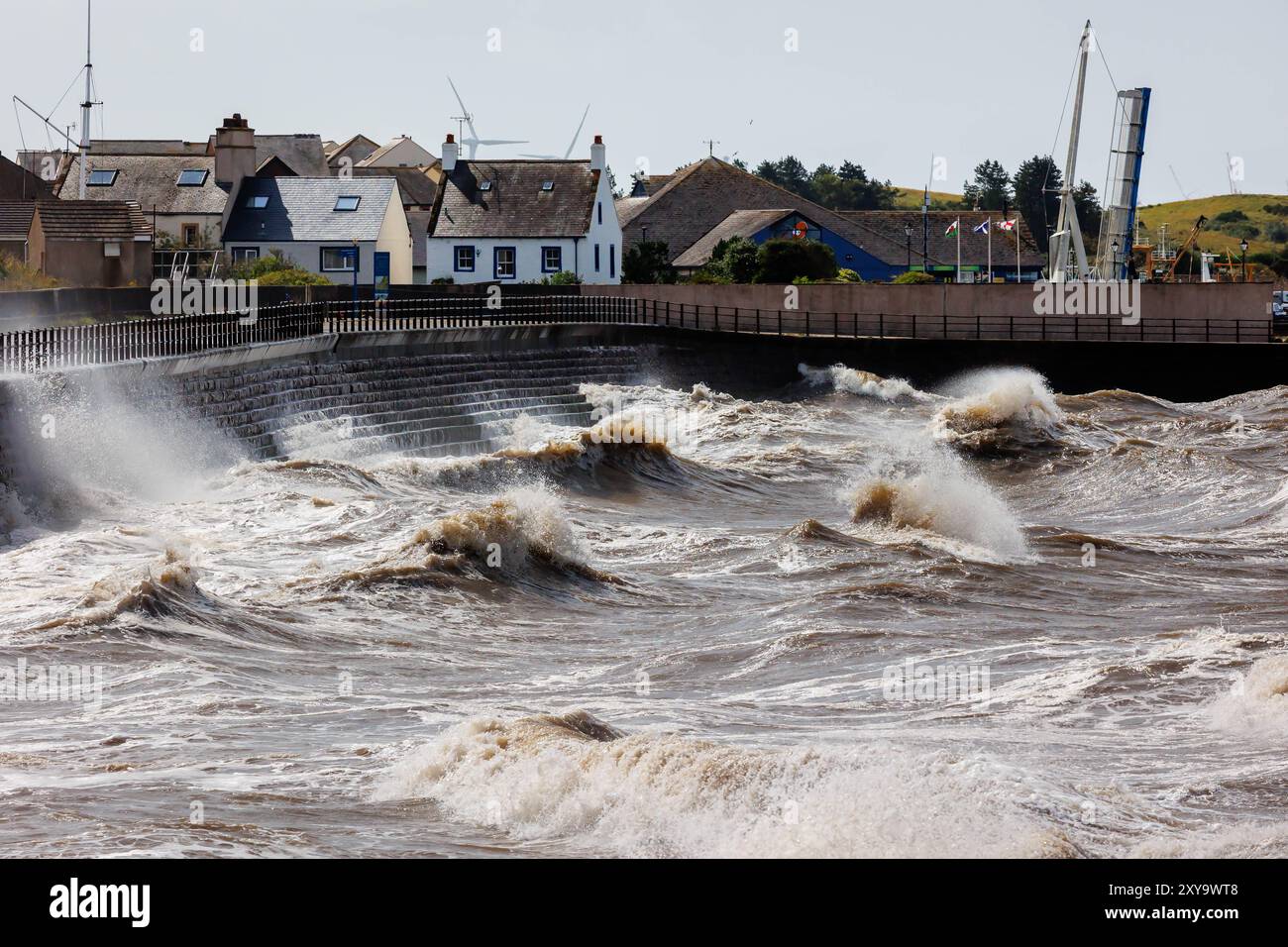 Stormy seas creating huge waves against the steps at the entrance to ...