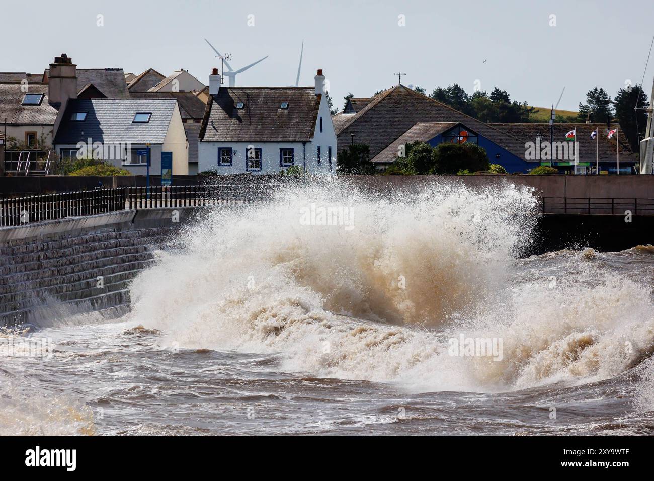 Stormy seas creating huge waves against the steps at the entrance to ...