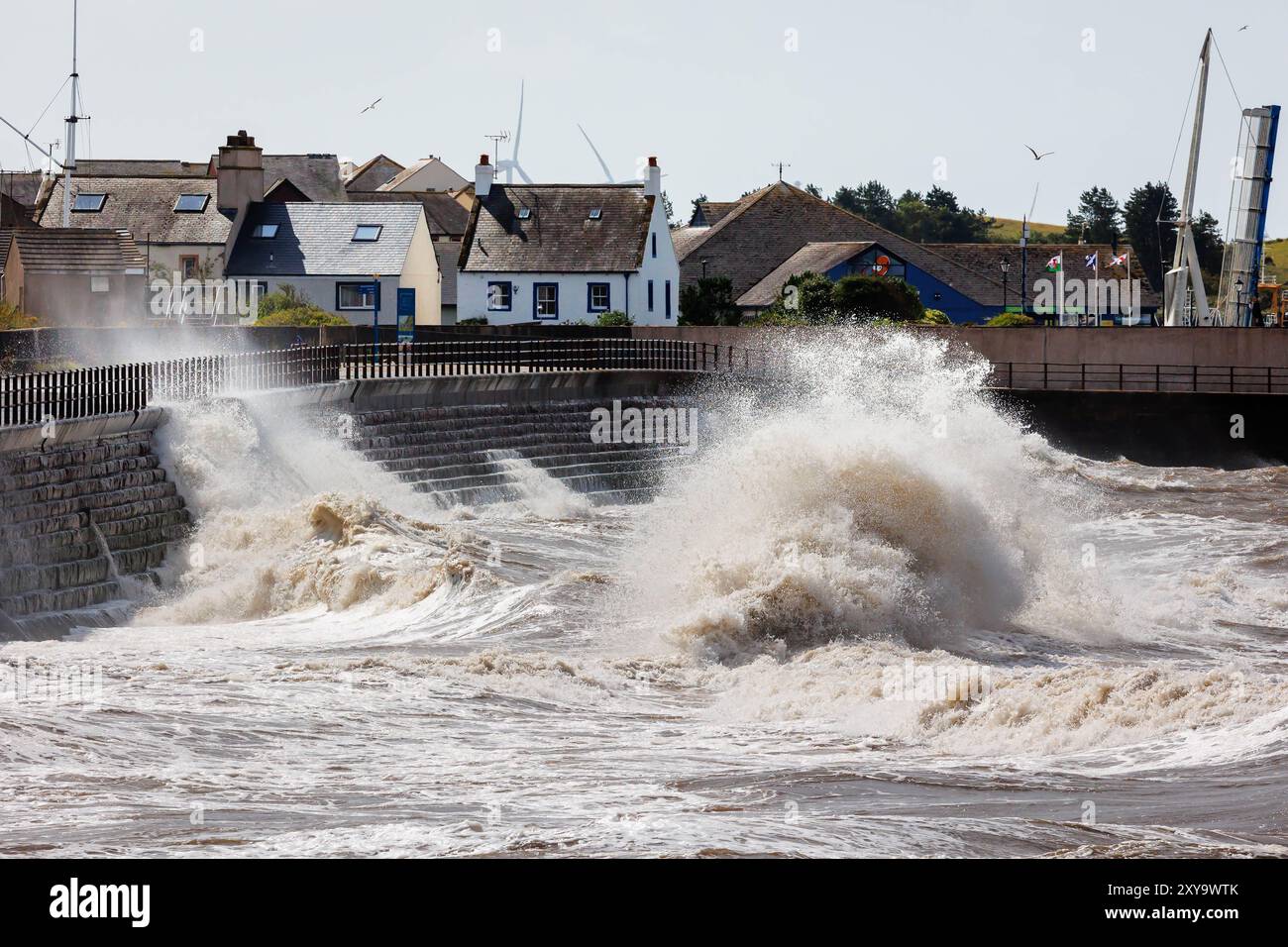 Stormy seas creating huge waves against the steps at the entrance to ...