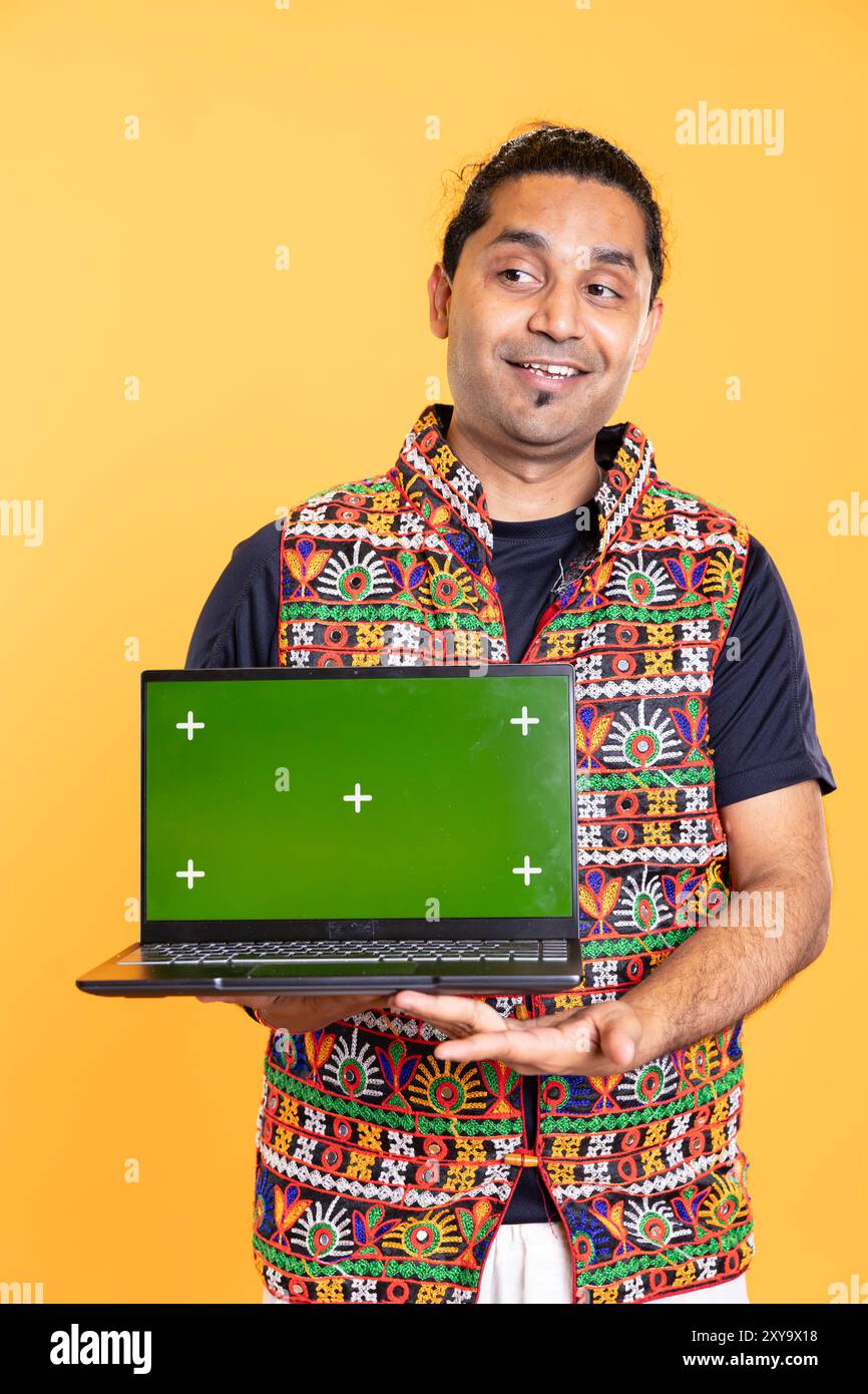 Portrait of happy worker holding isolated screen laptop, doing ...