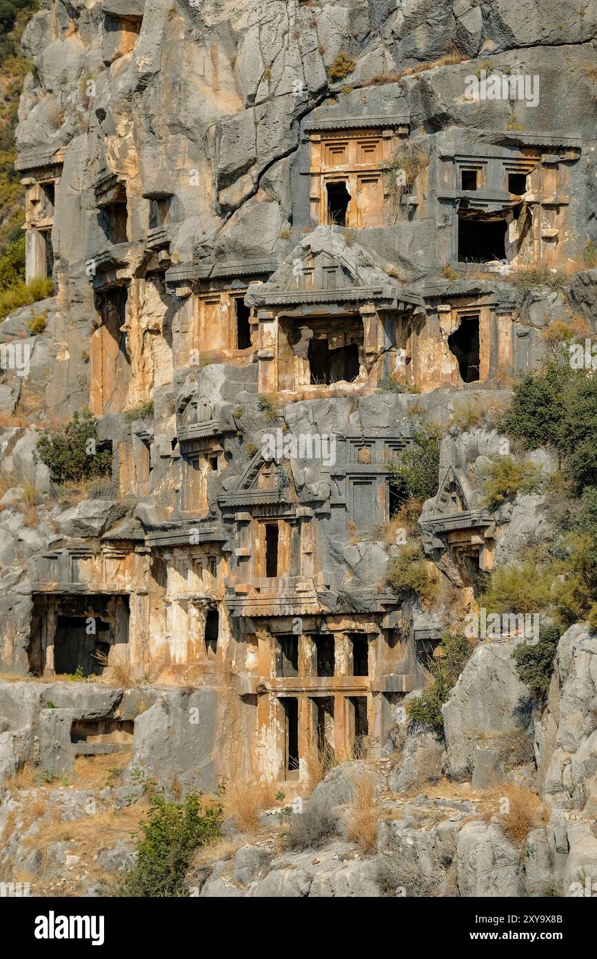 Demre, Turkey - August 24, 2024: Rock-cut tombs in the ruins of Myra ...
