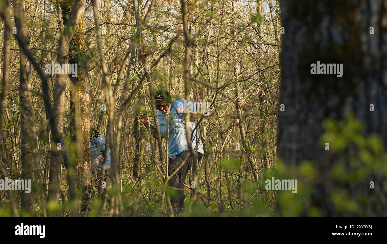 Group of lifesavers volunteers searching for a missing person, calling ...