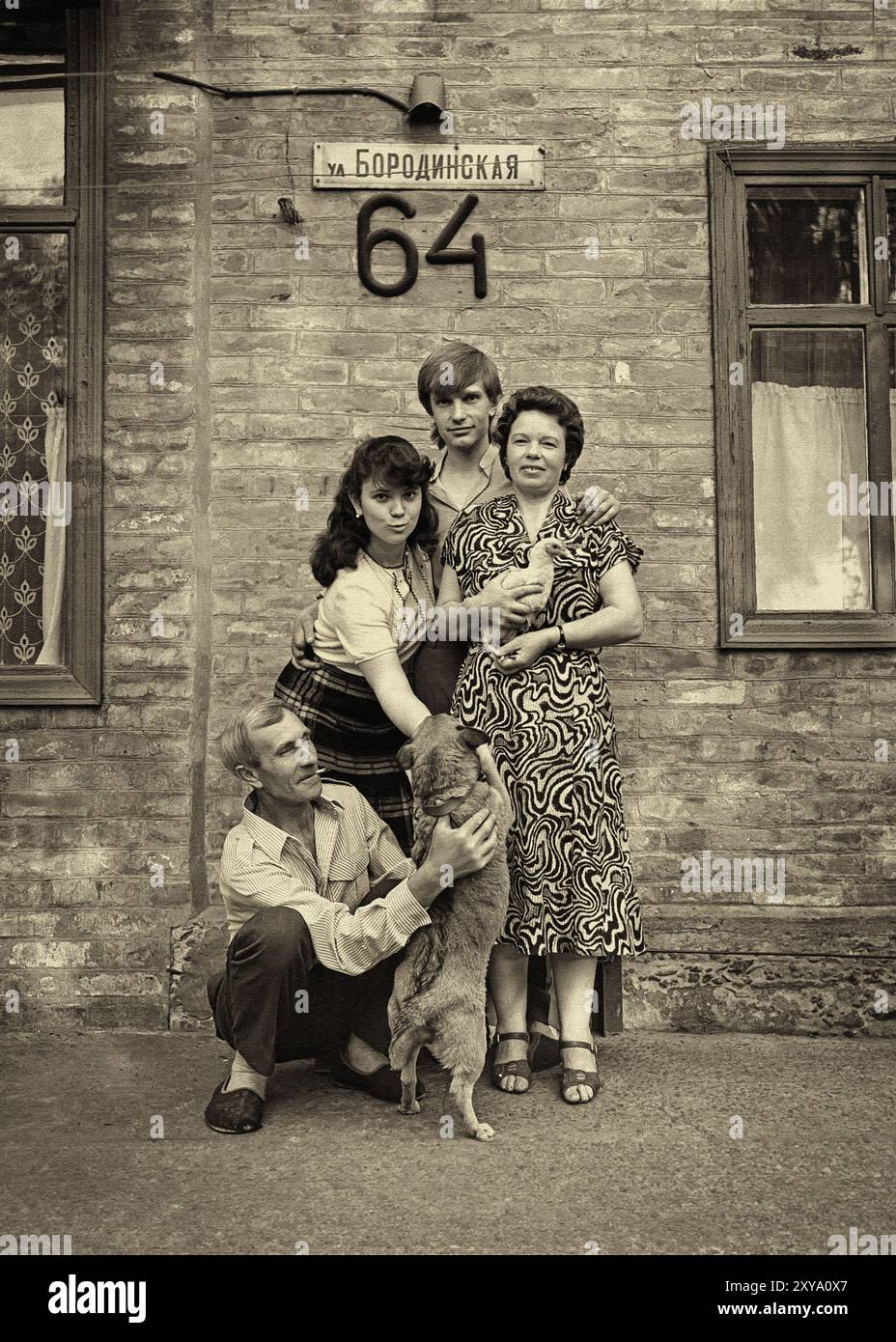 Portrait of a Ukrainian family in the courtyard of their house ...