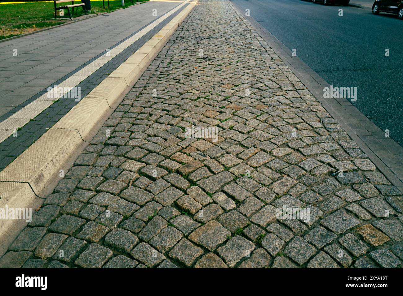 Pavement road. Background of bricks road. Stone cladding pavement ...