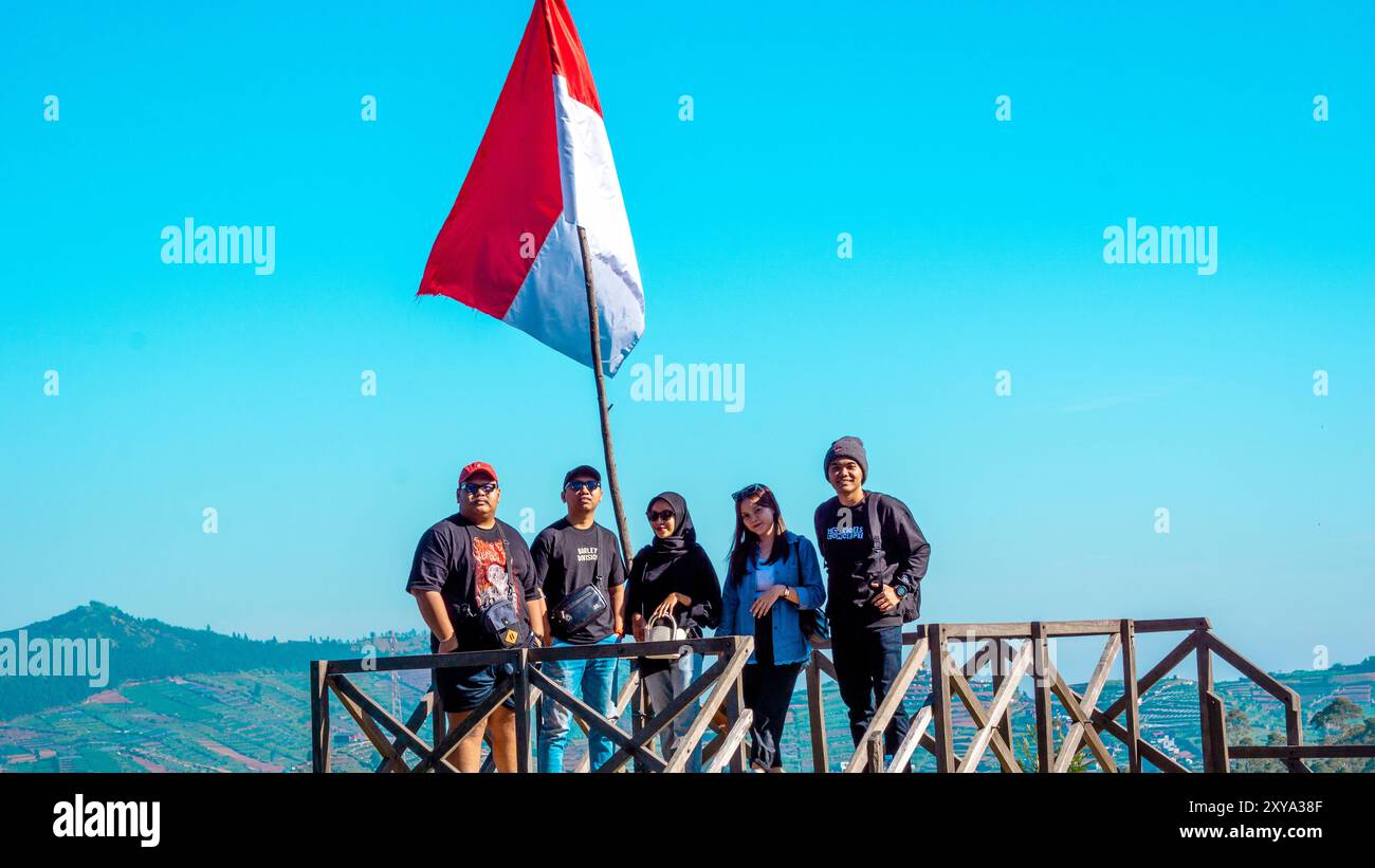 People vacation on Batu Pandang Ratapan Angin, one of the famous ...