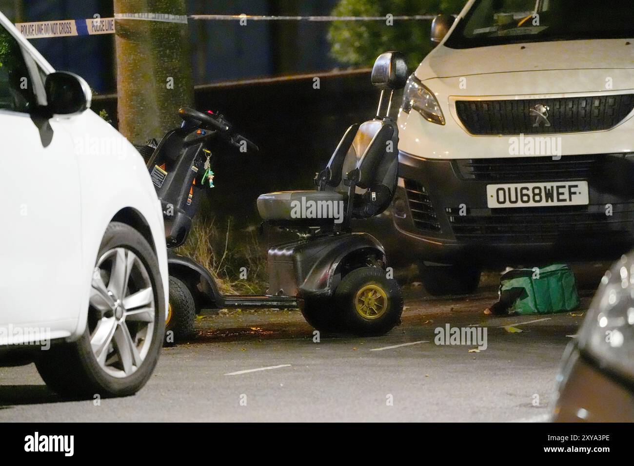 A black and grey electric wheelchair on Overbury Street near to ...