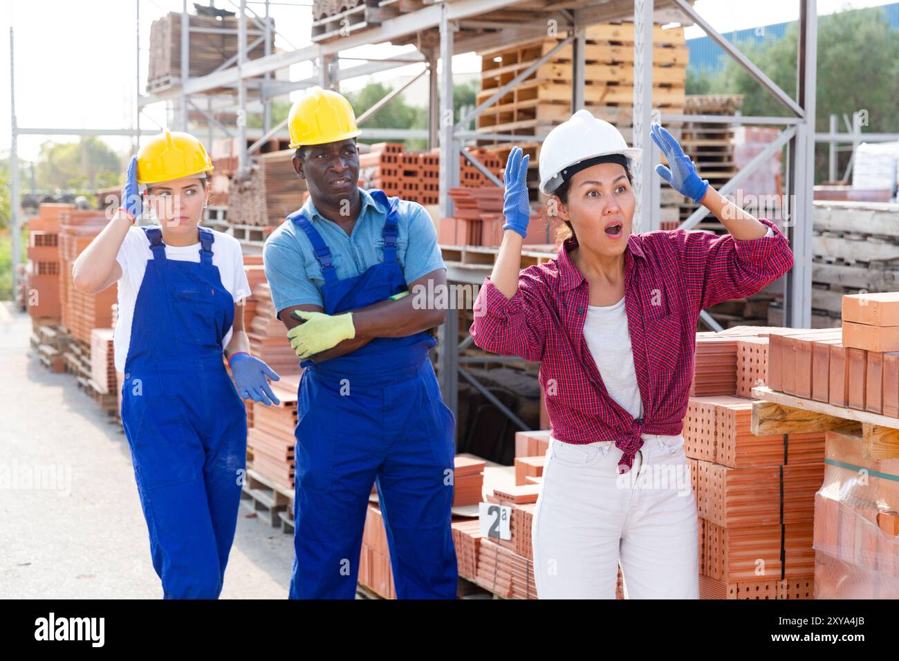 Portrait of surprised employees working in a warehouse Stock Photo - Alamy