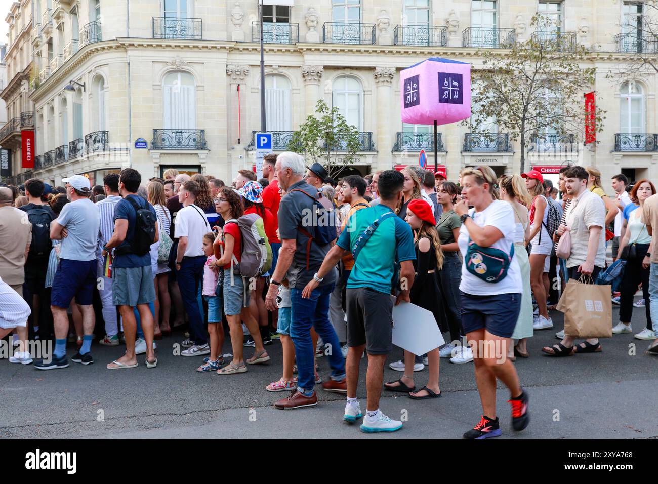 People celebrate the opening ceremony in the streets around Concorde ...