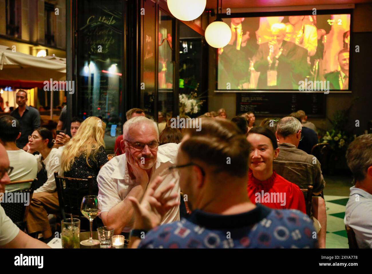 People celebrate the opening ceremony in the streets around Concorde ...