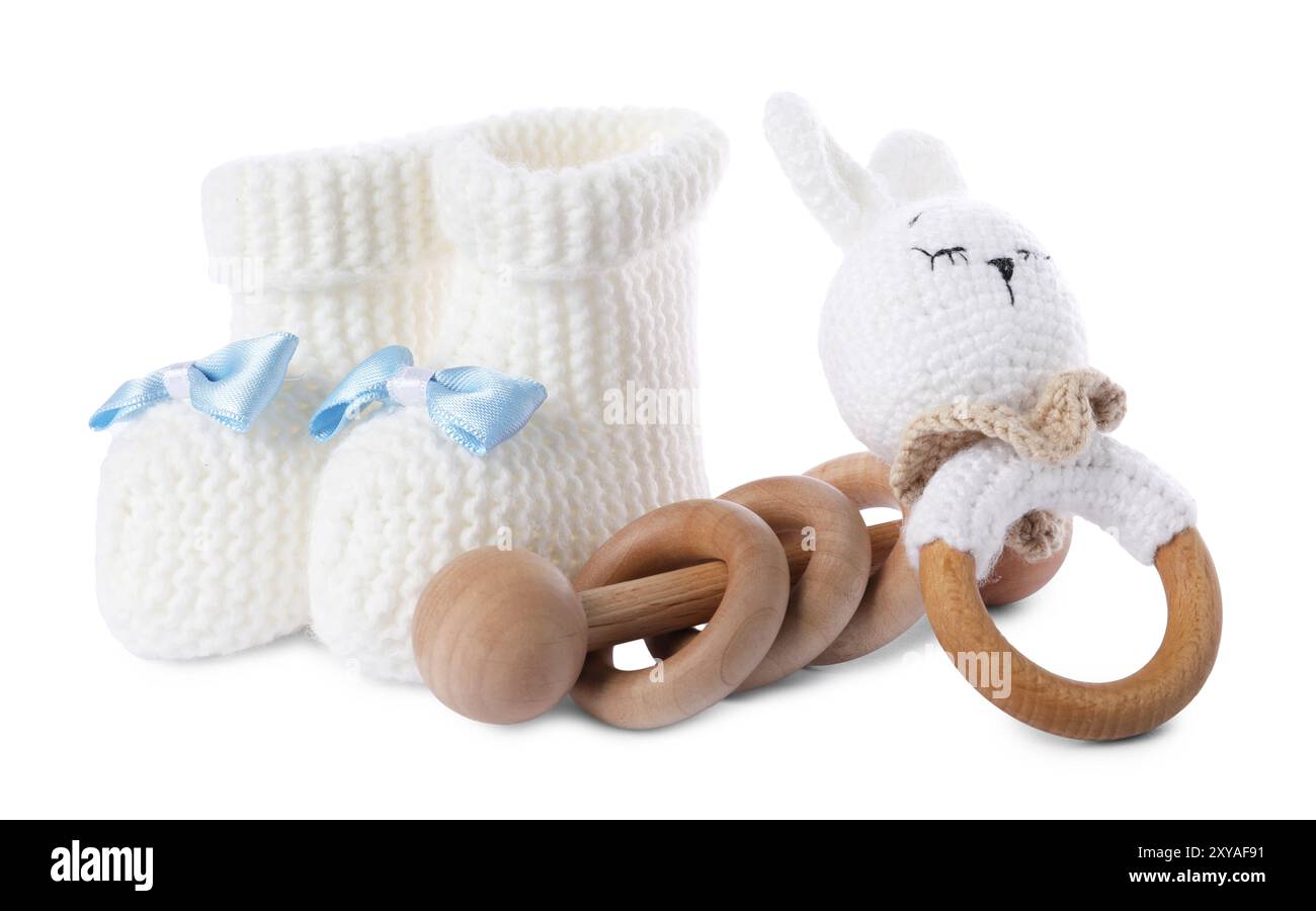 Baby rattles and booties isolated on white Stock Photo - Alamy