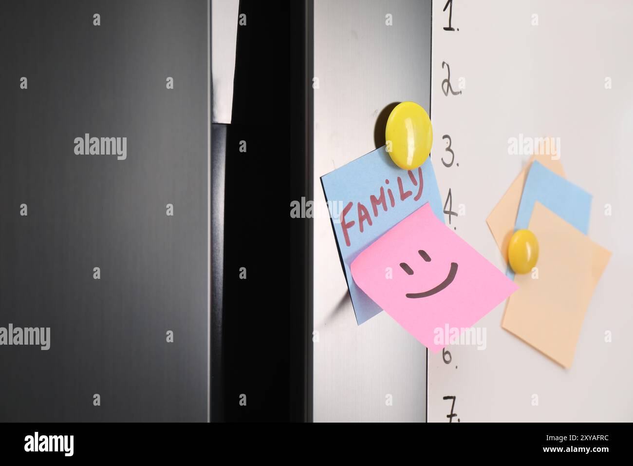 Magnetic board with to do list and notes on refrigerator, closeup Stock ...