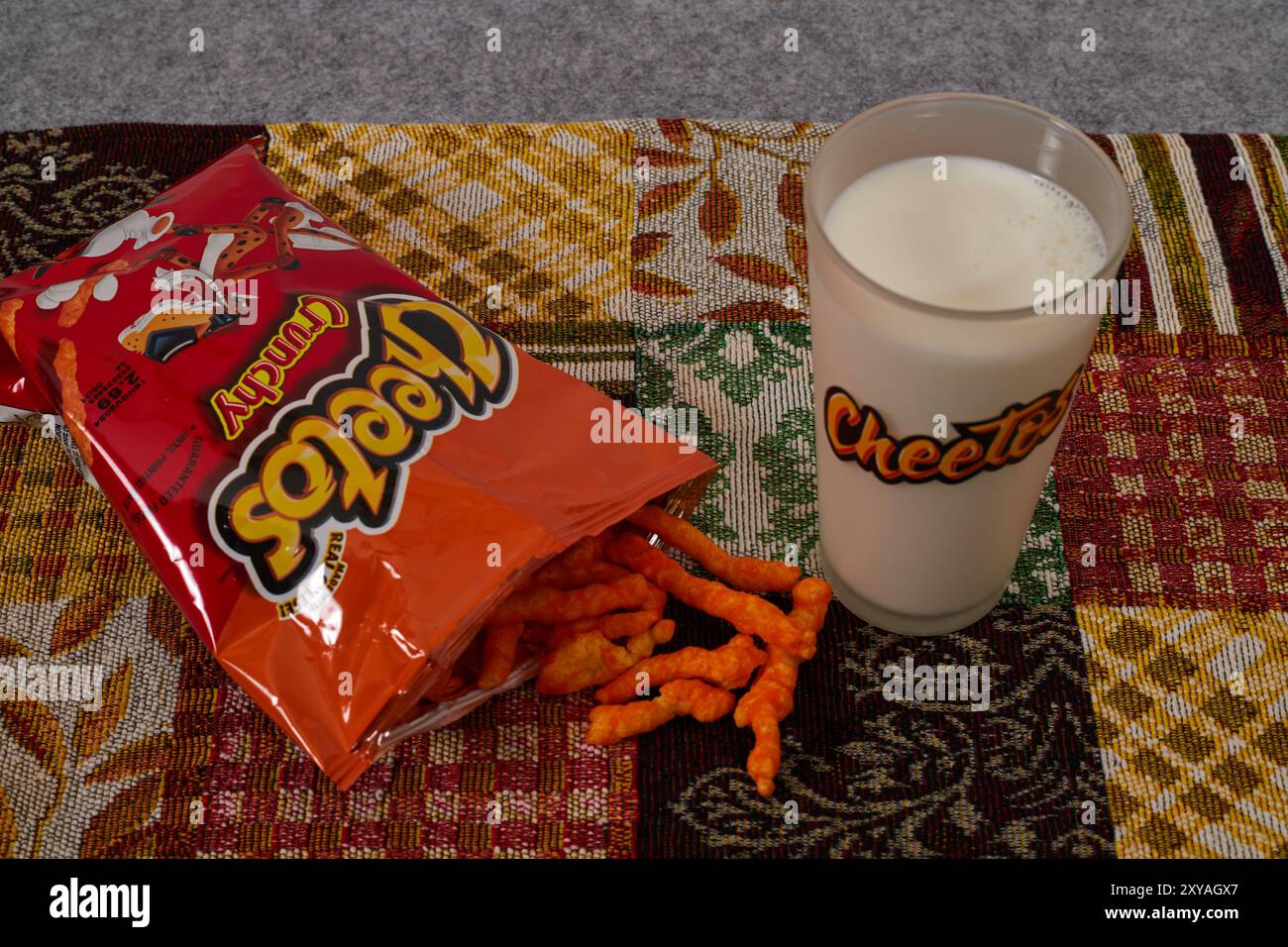 Cheetos crunchy with a glass of milk. Charles Elmer Doolin invented ...