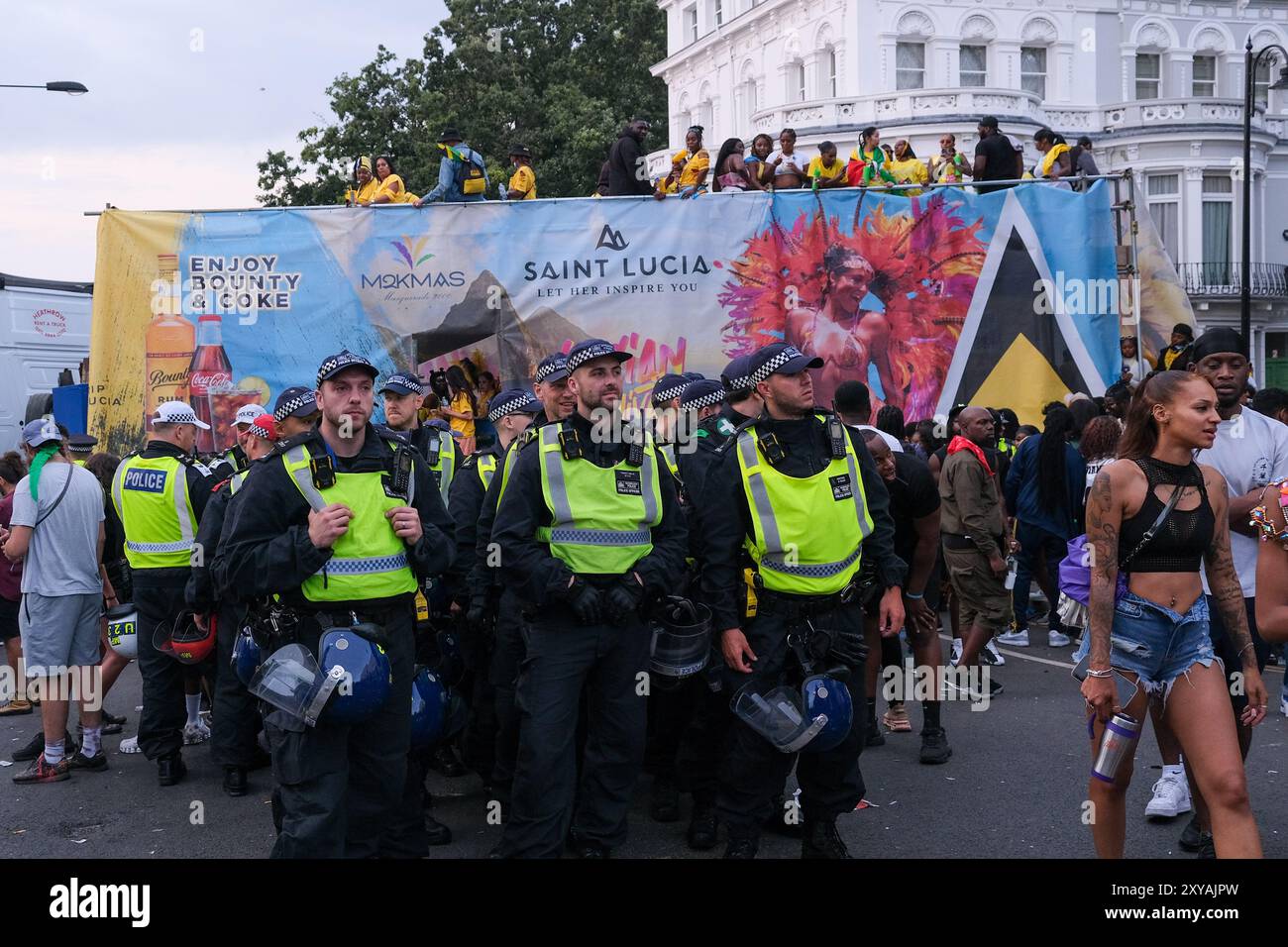 Police officers await instruction at the Notting Hill Carnival as the ...