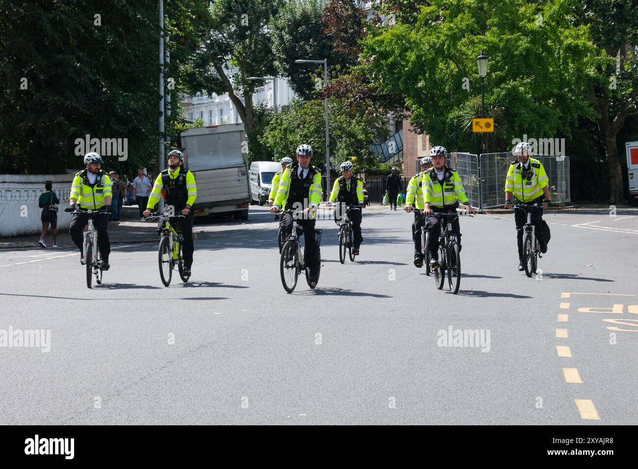 A mobile policing unit on pushbikes patrol the circuit of the Notting ...