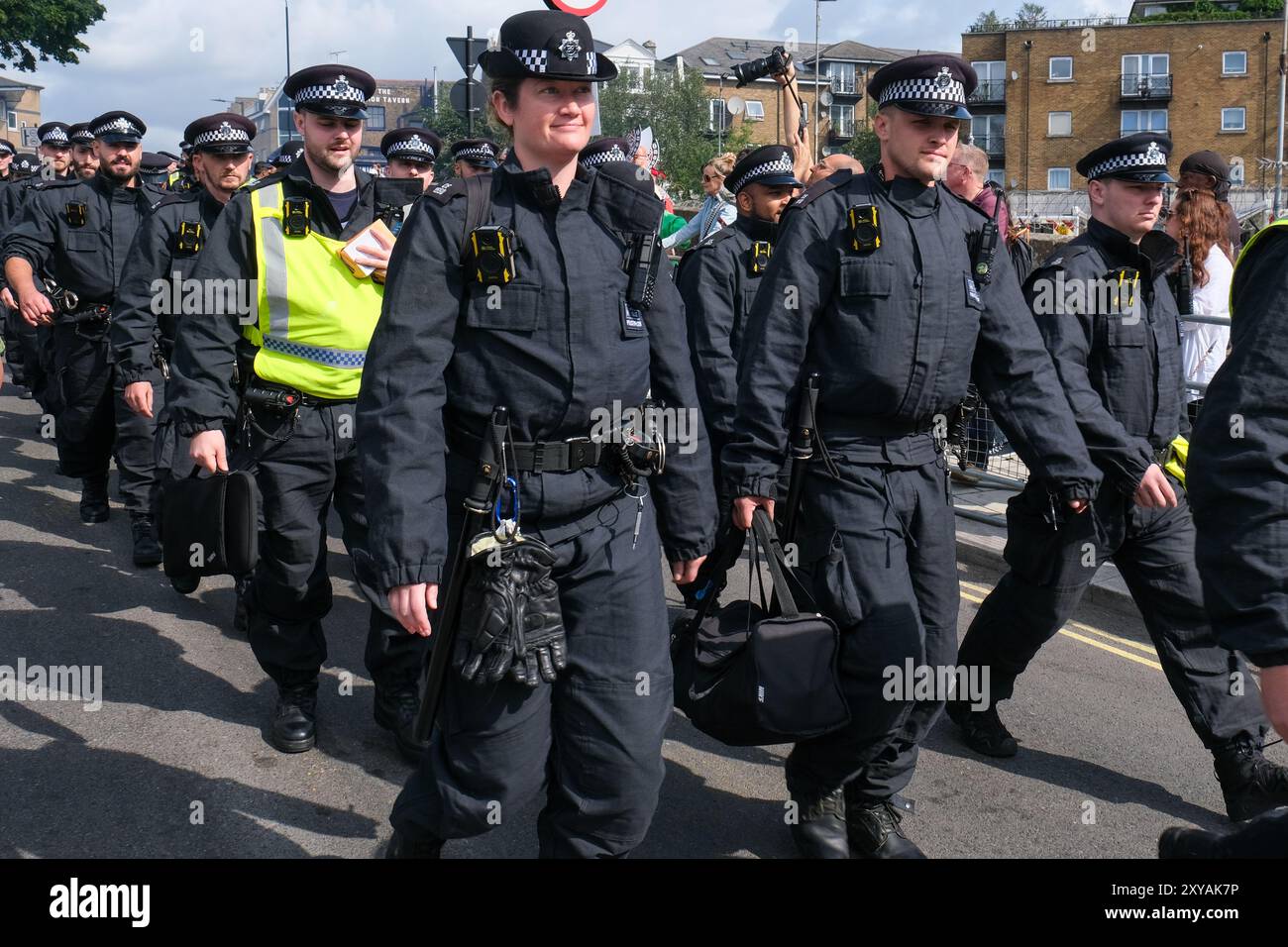 A policing unit clocks on for the day and moves into position with ...