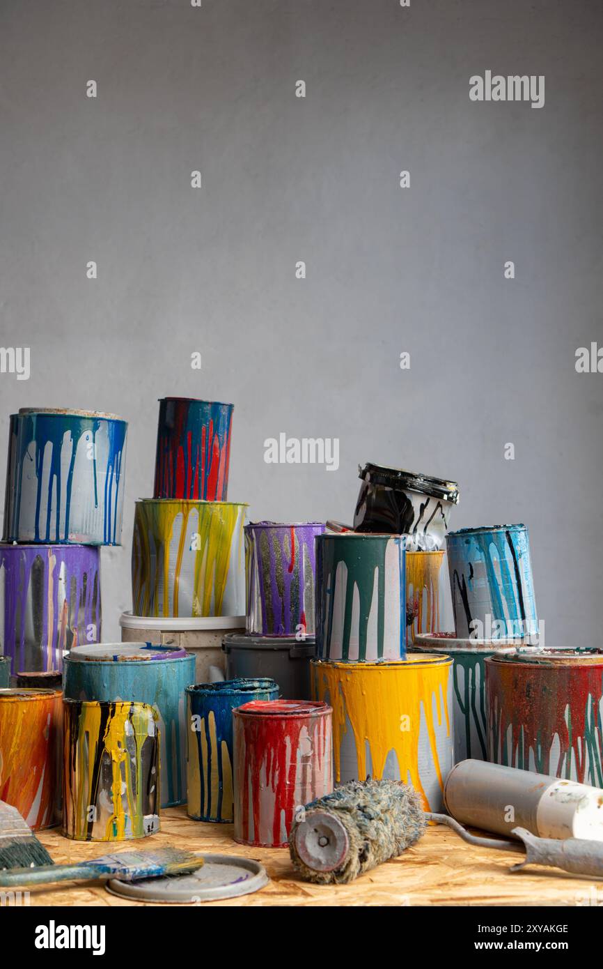 Cans of colored paint. Interior Painting, Art studio. Copy space ...