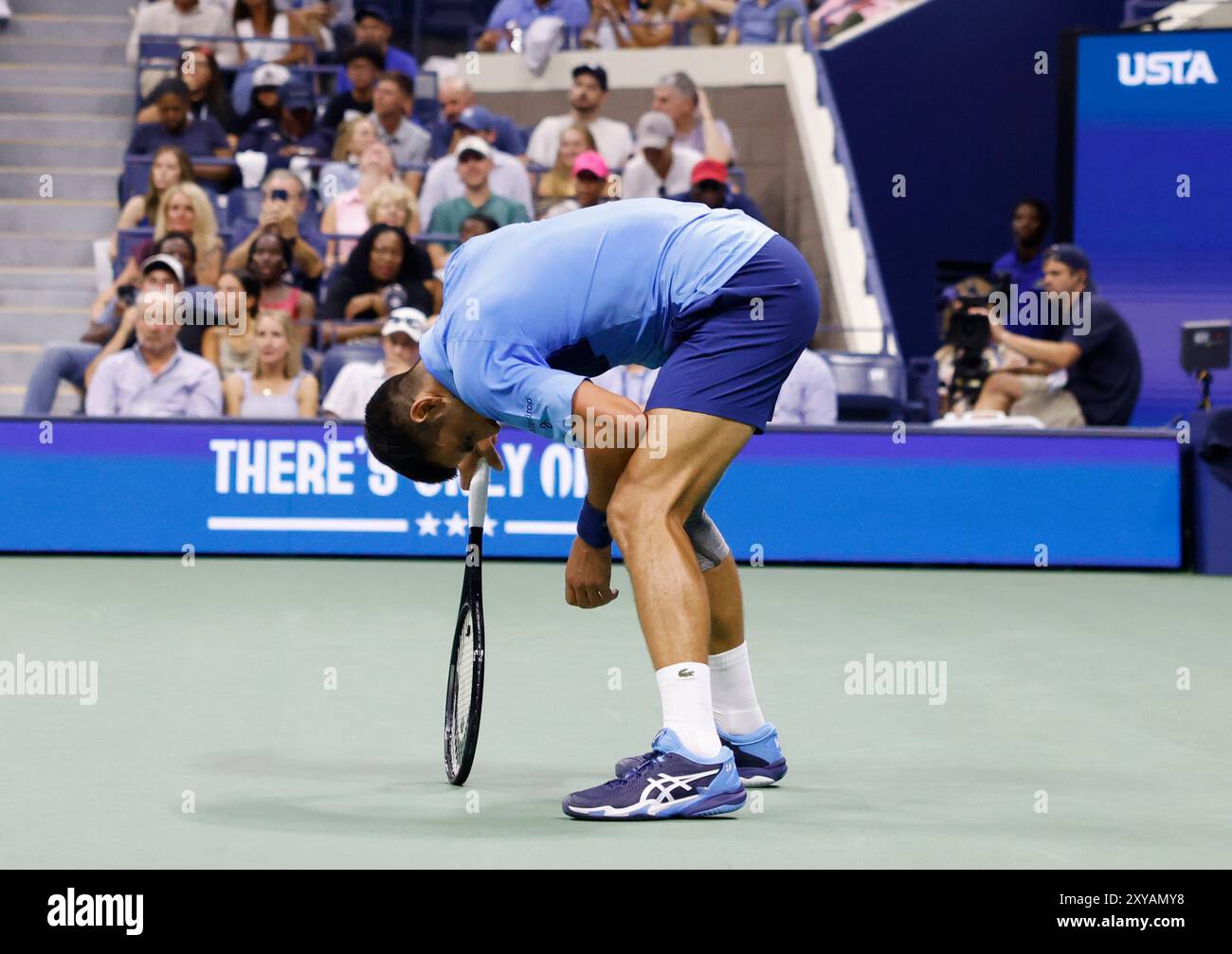 Novak Djokovic of Serbia reacts after losing a point against Laslo ...