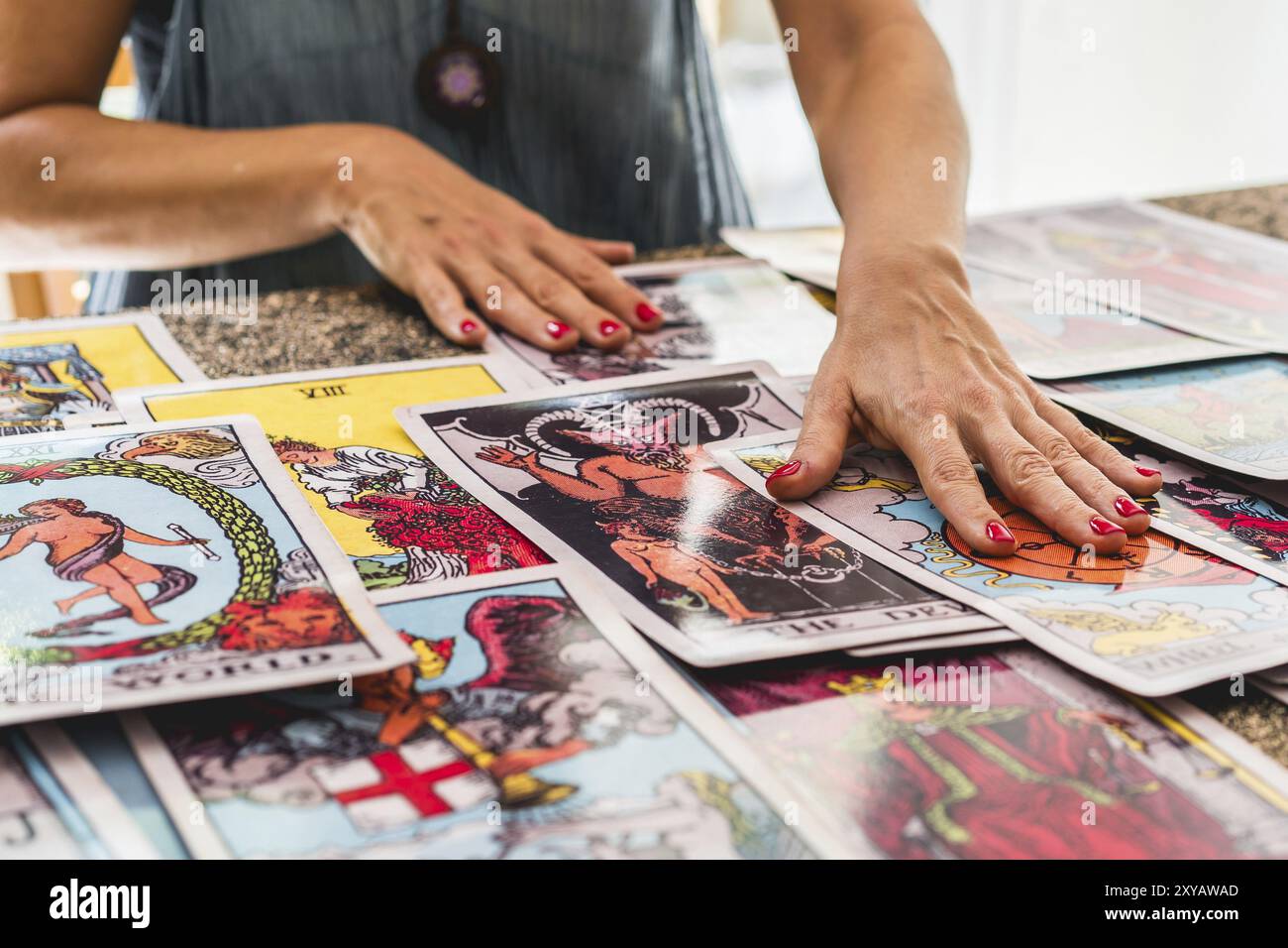 Tarot reader mixing the giant Tarot cards Stock Photo - Alamy