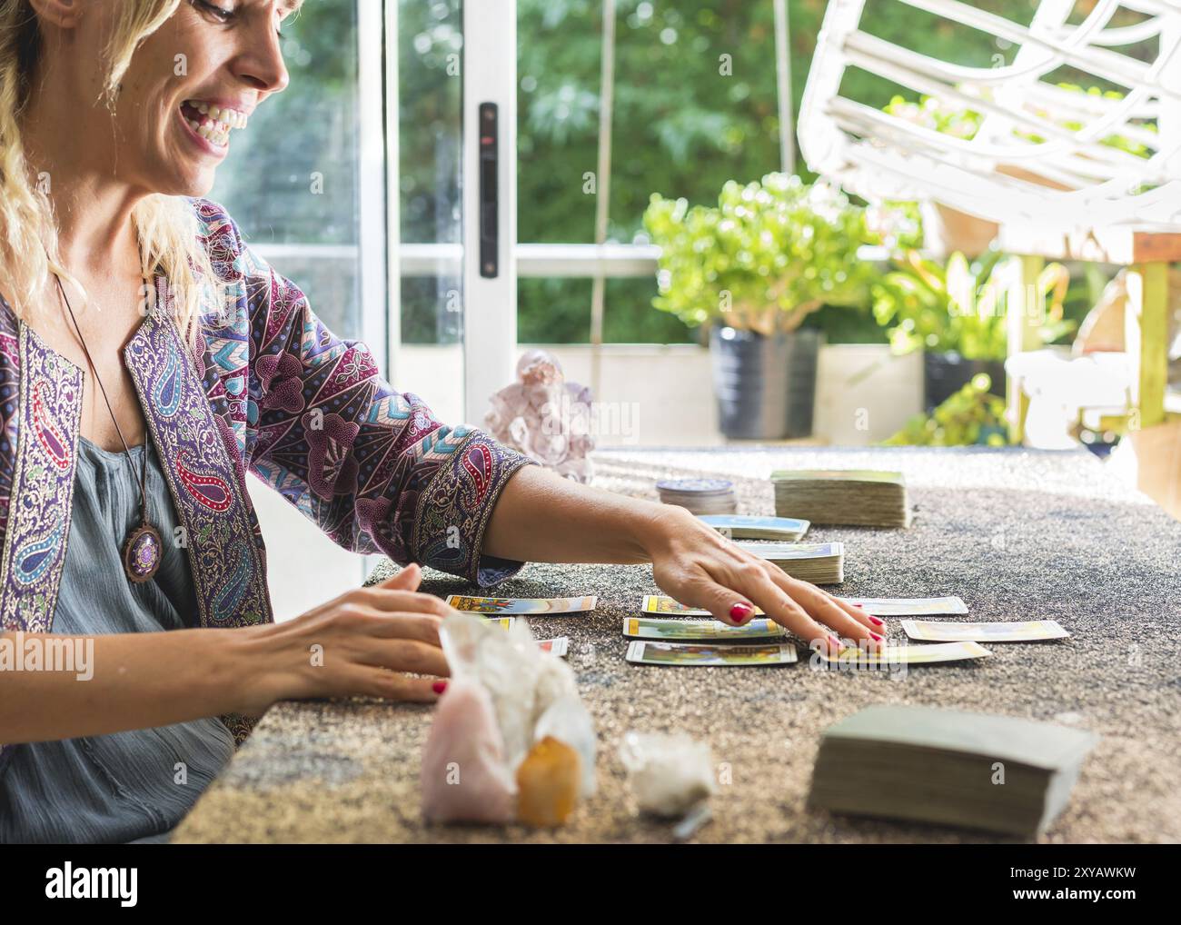 Side view of a tarot reader reading the cards Stock Photo - Alamy