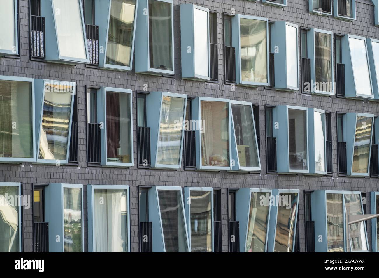 Box-shaped windows, at different angles, facade of a residential ...