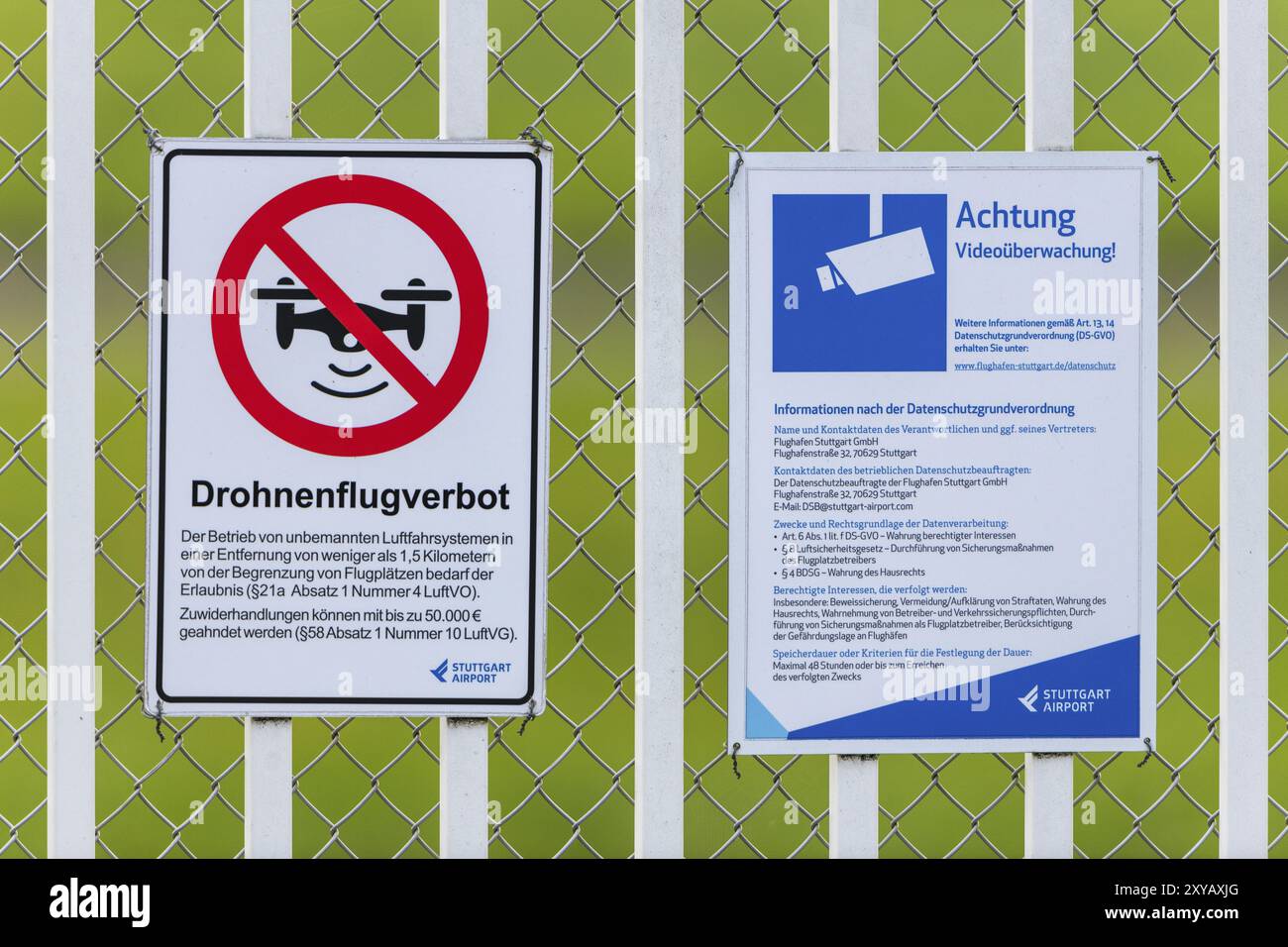 Signs on an airport barrier fence, video surveillance, drone flight ban ...