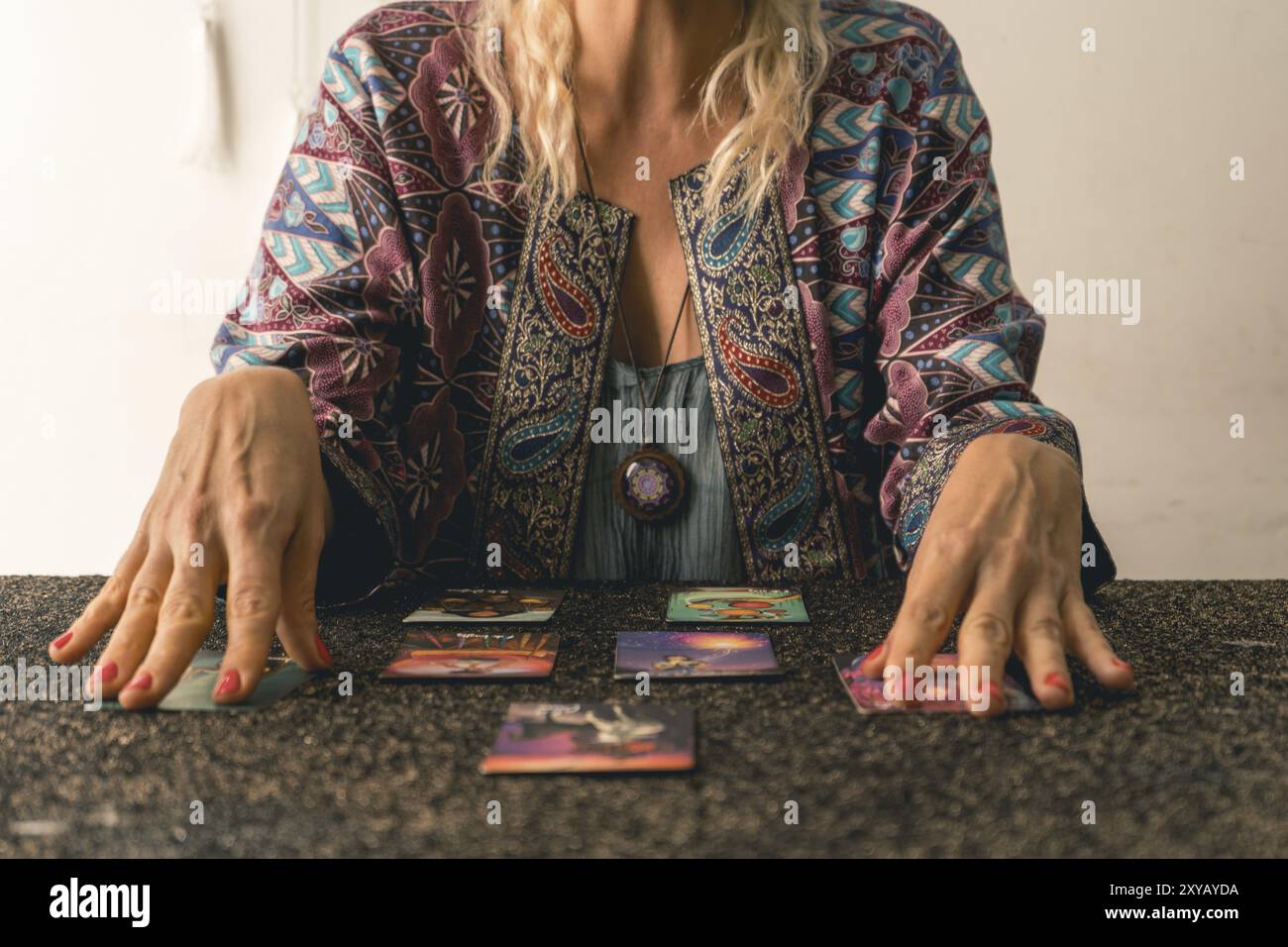 Close-up of a tarot reader's hands as she interprets the messages from ...