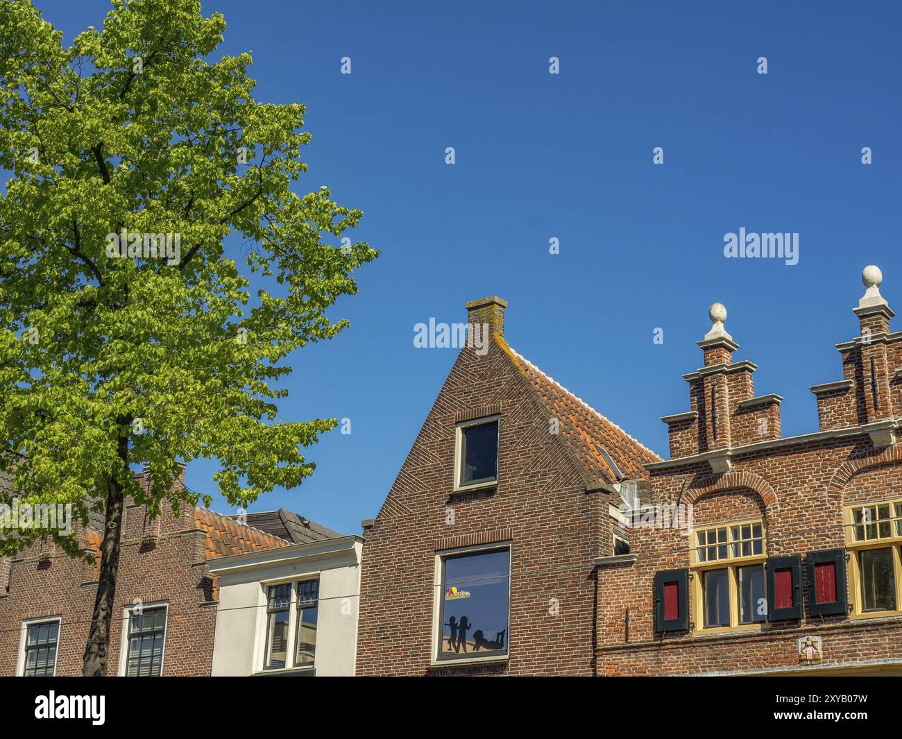 Traditional brick houses with repeating windows and light textures ...