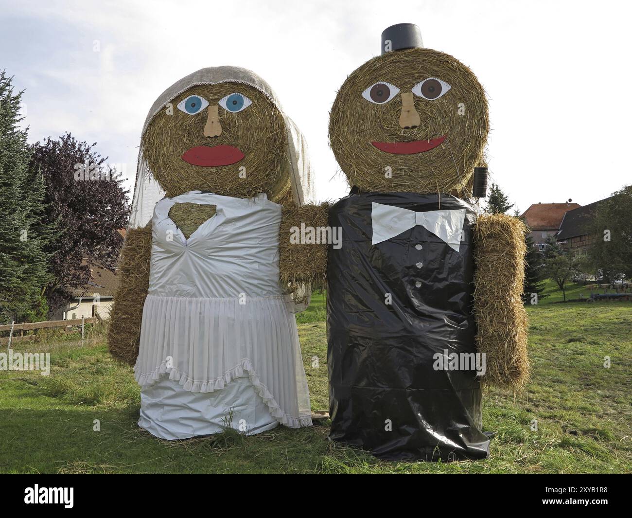 Bridal couple made of straw rolls Stock Photo - Alamy
