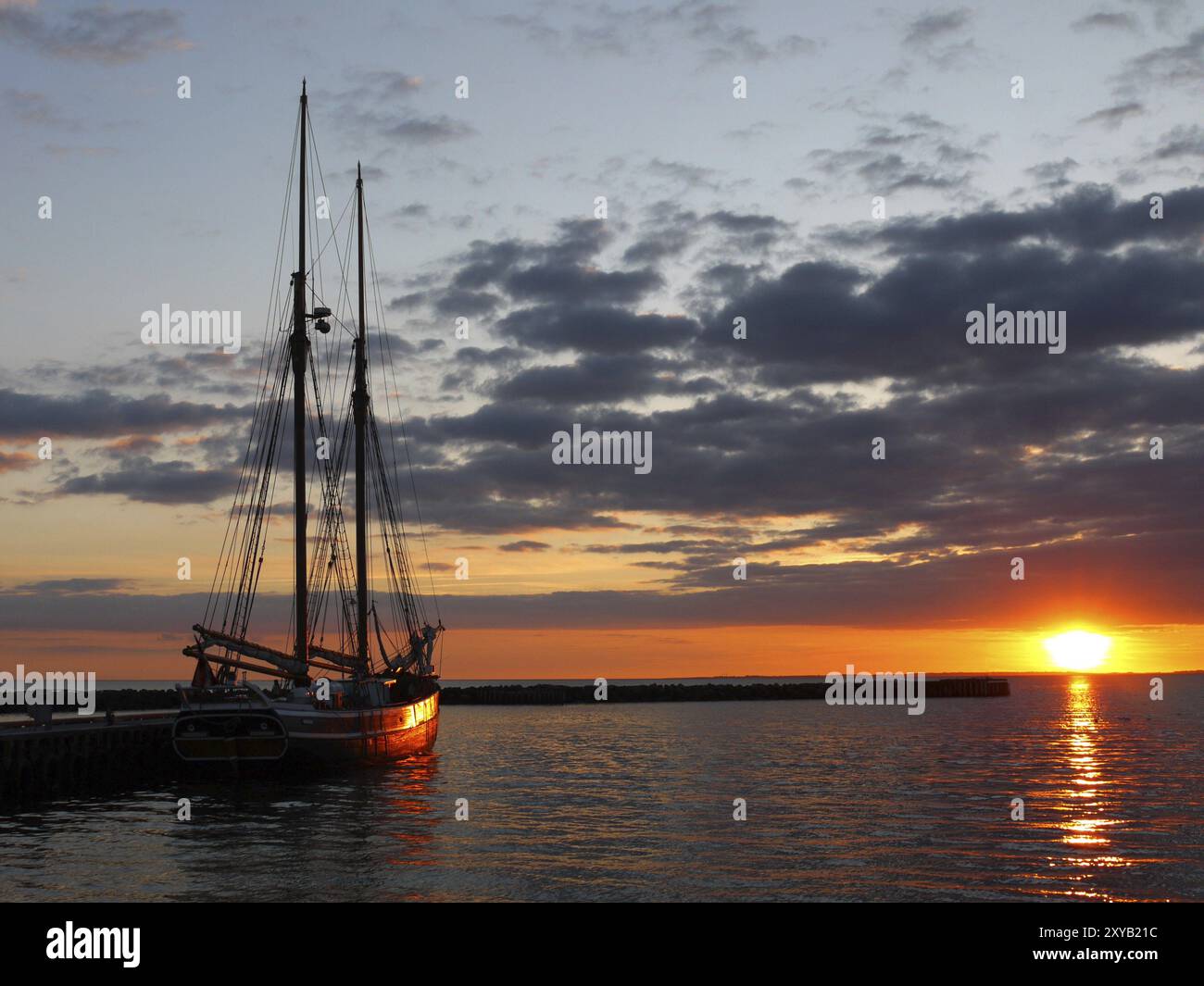Tall ships in the sunset Stock Photo - Alamy