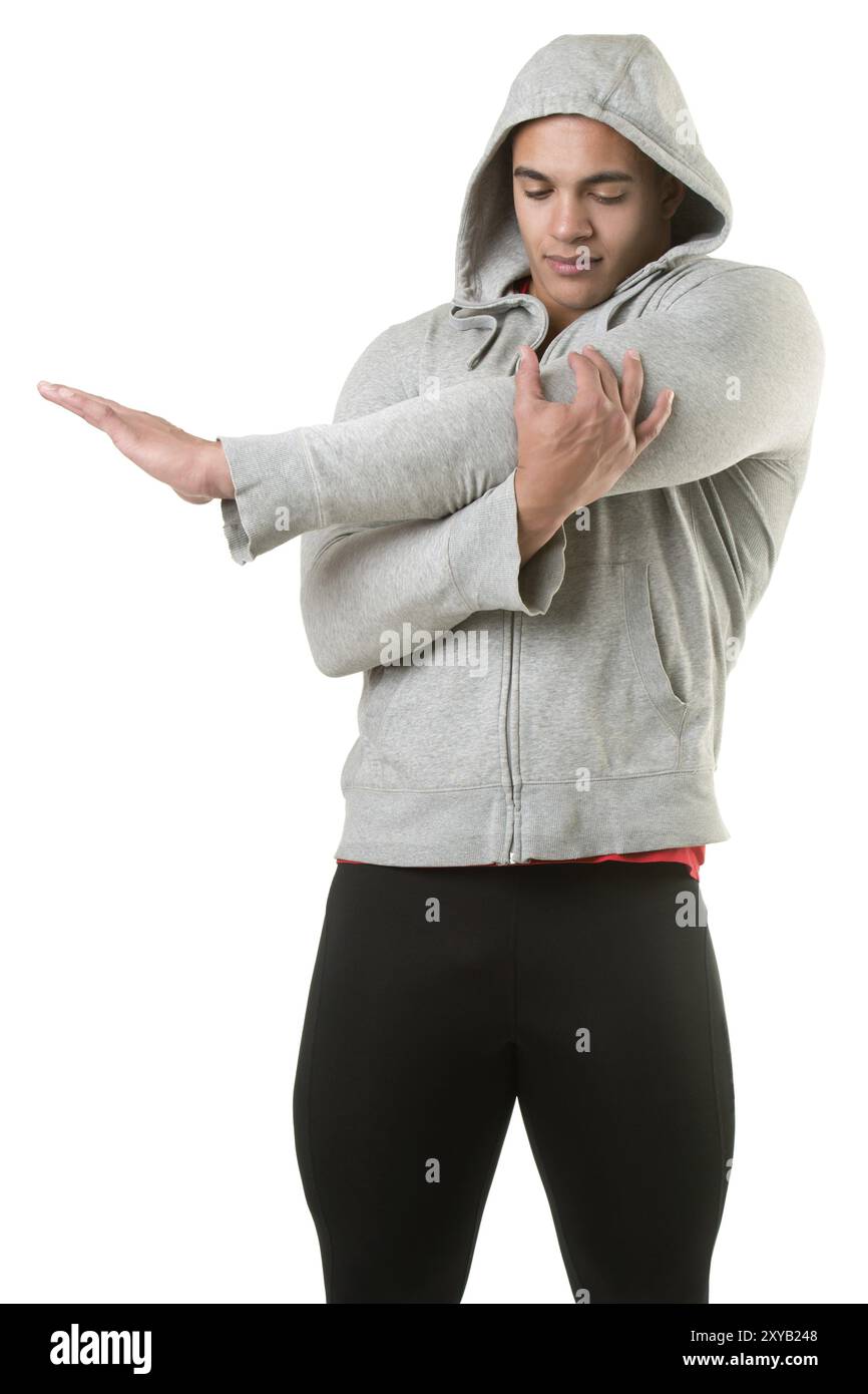 Fit man stretching his arm after working out, isolated Stock Photo - Alamy