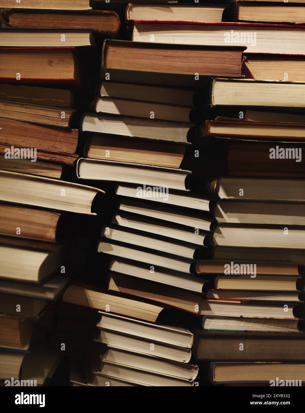 Pile of old dirty books on book shelf. Background Stock Photo - Alamy