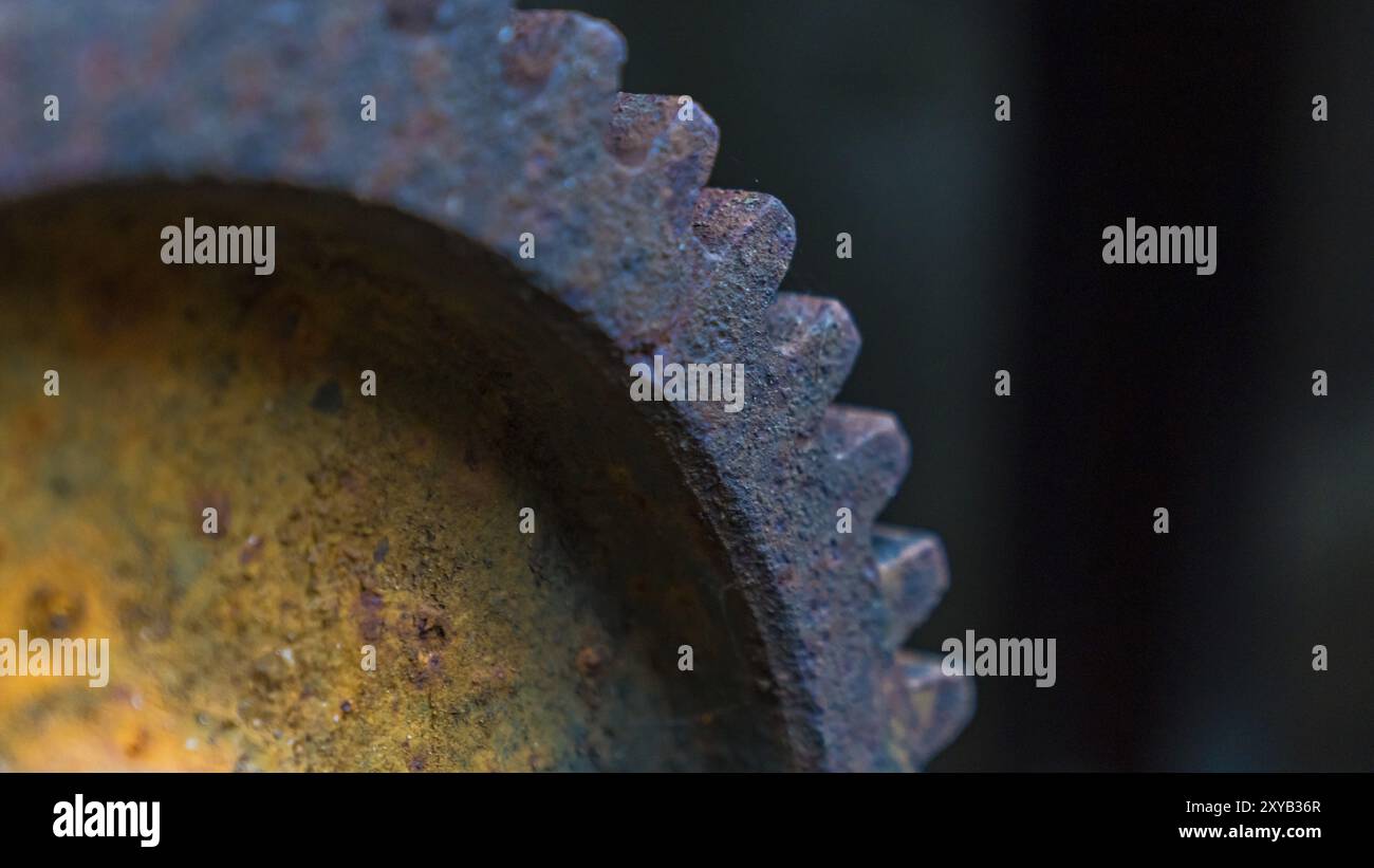 Old rusty gear wheel with blurry background Stock Photo - Alamy