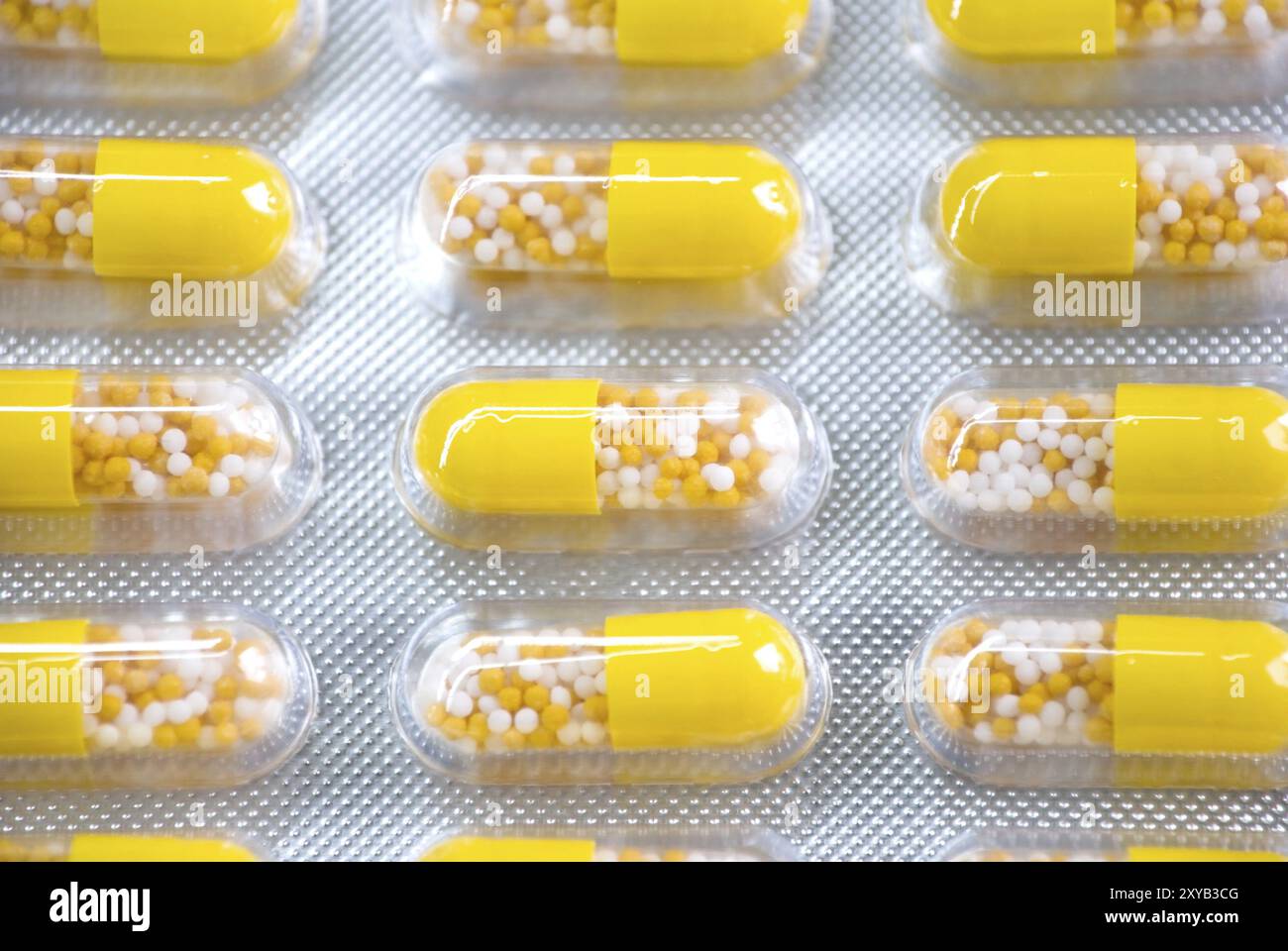 Macro of yellow medicine capsules Stock Photo - Alamy
