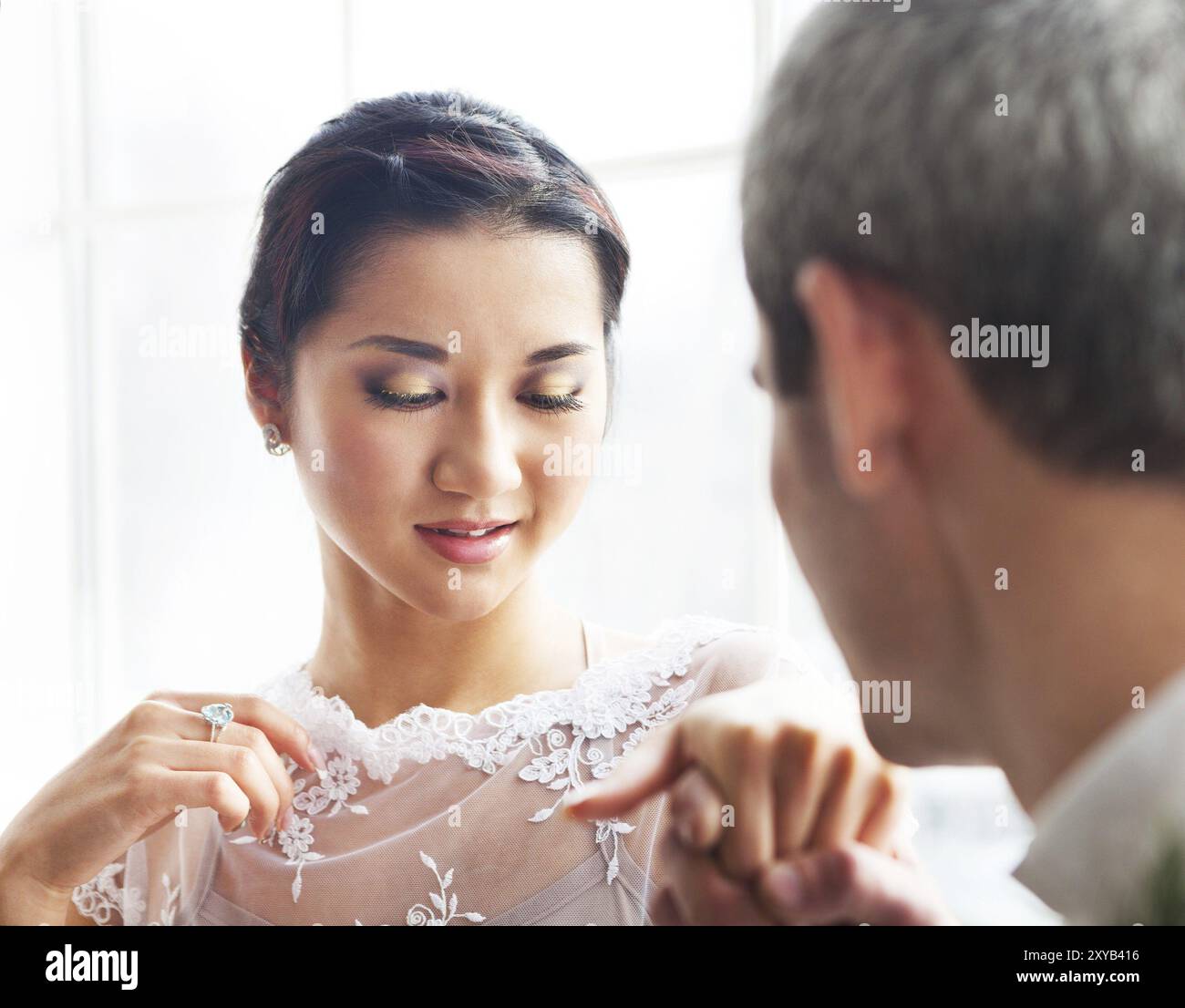 Cheerful married couple. Focus on the bride Stock Photo - Alamy