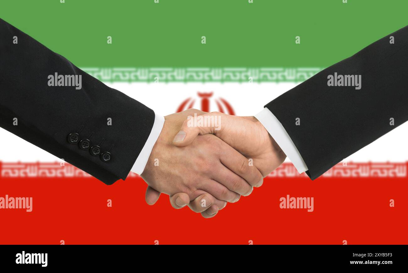The Iranian flag and business handshake Stock Photo - Alamy
